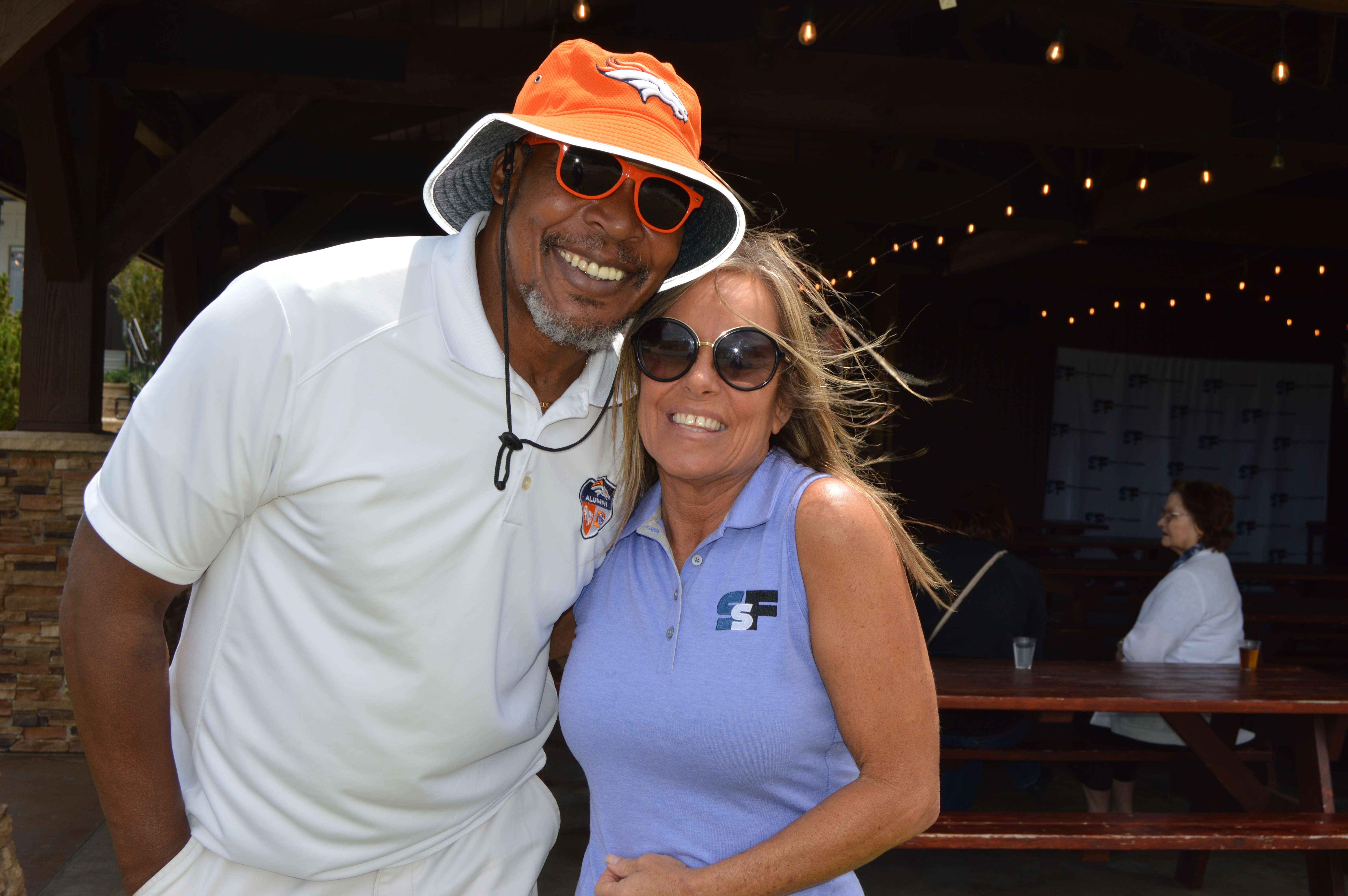 Former Denver Broncos linebacker Larry Evans and VP Development Teri Smith