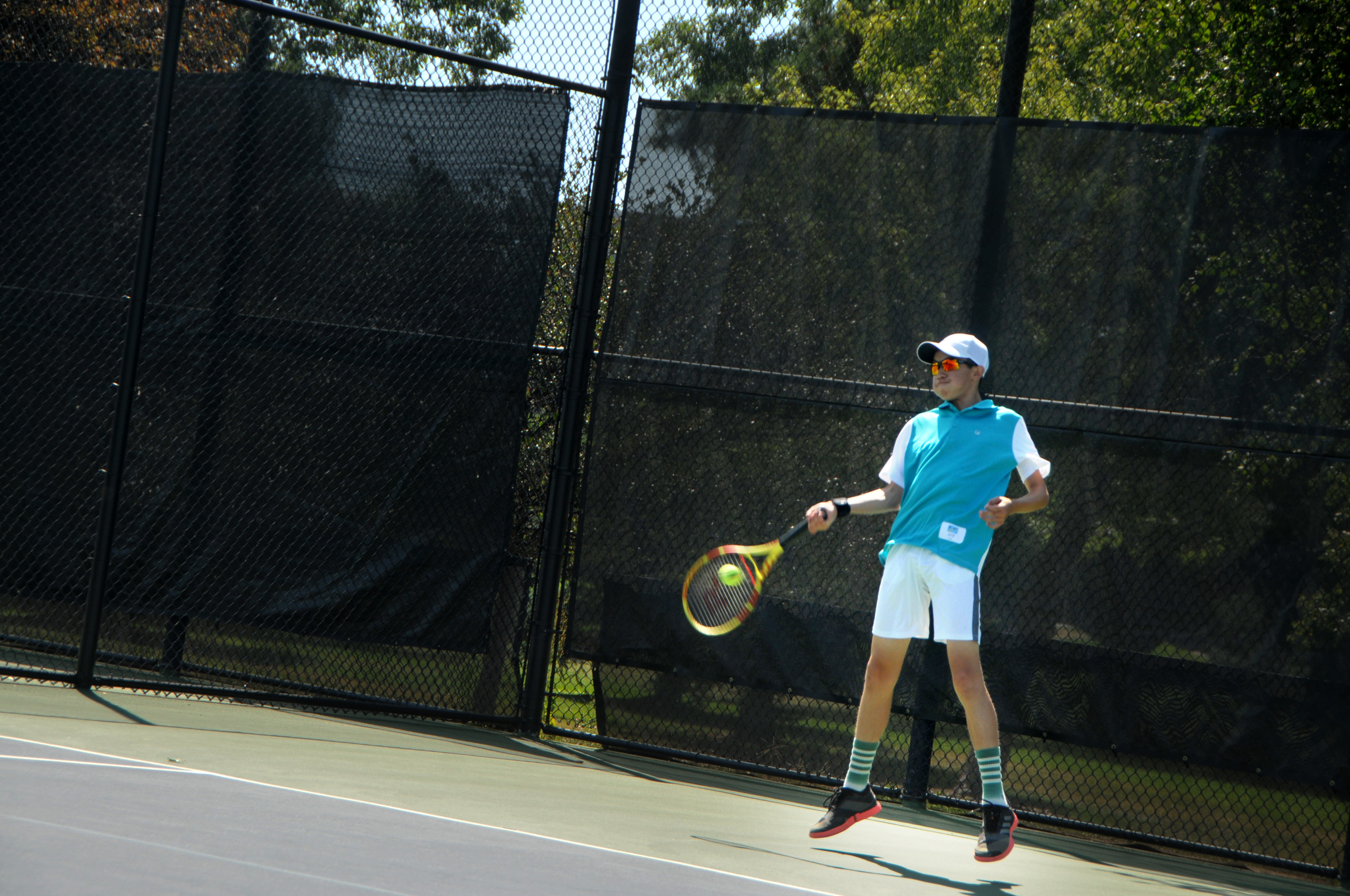 Seth Taylor returns a shot