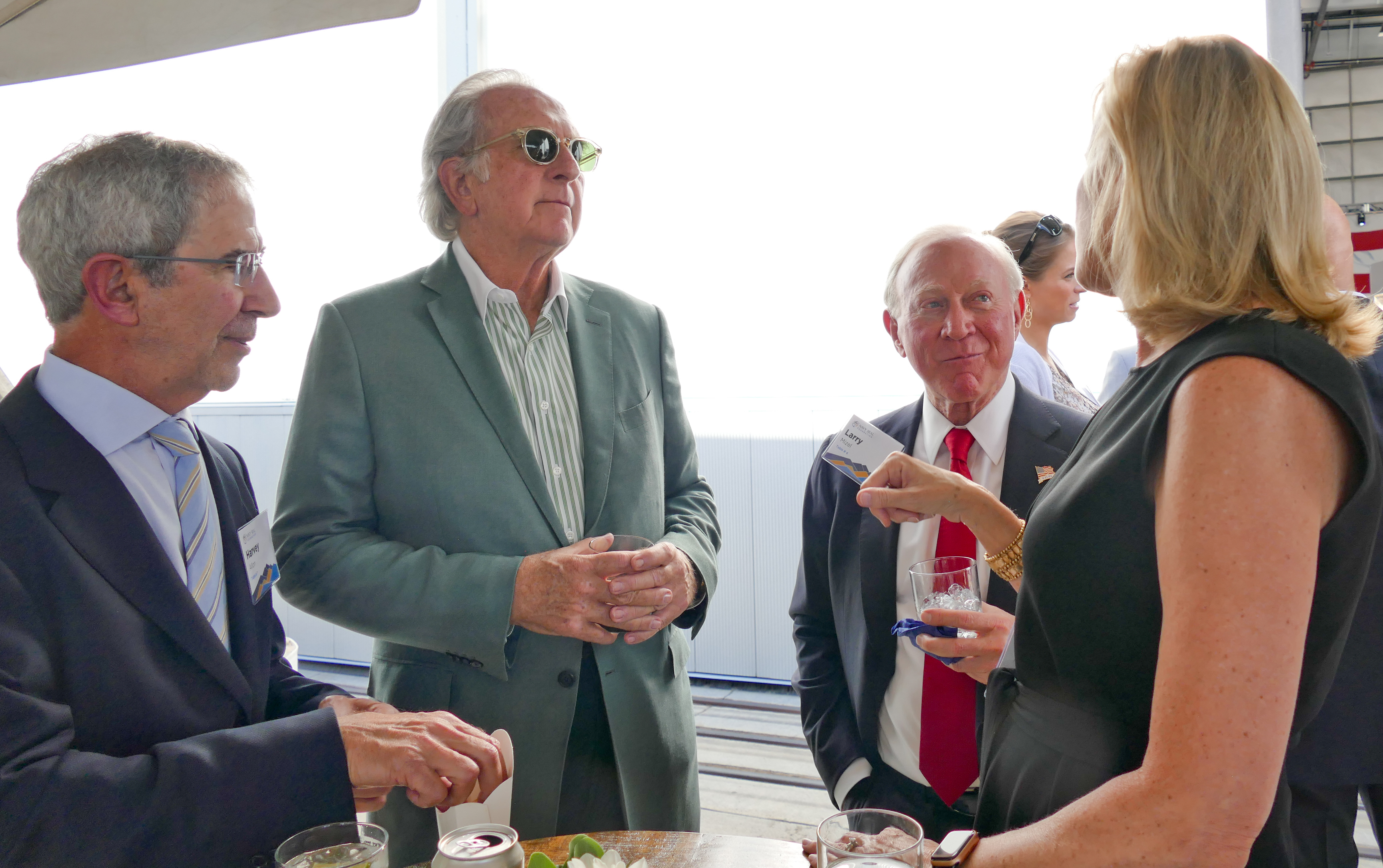 Harvey Allon, left, Norm Brownstein and Larry Mizel chat with Robin King