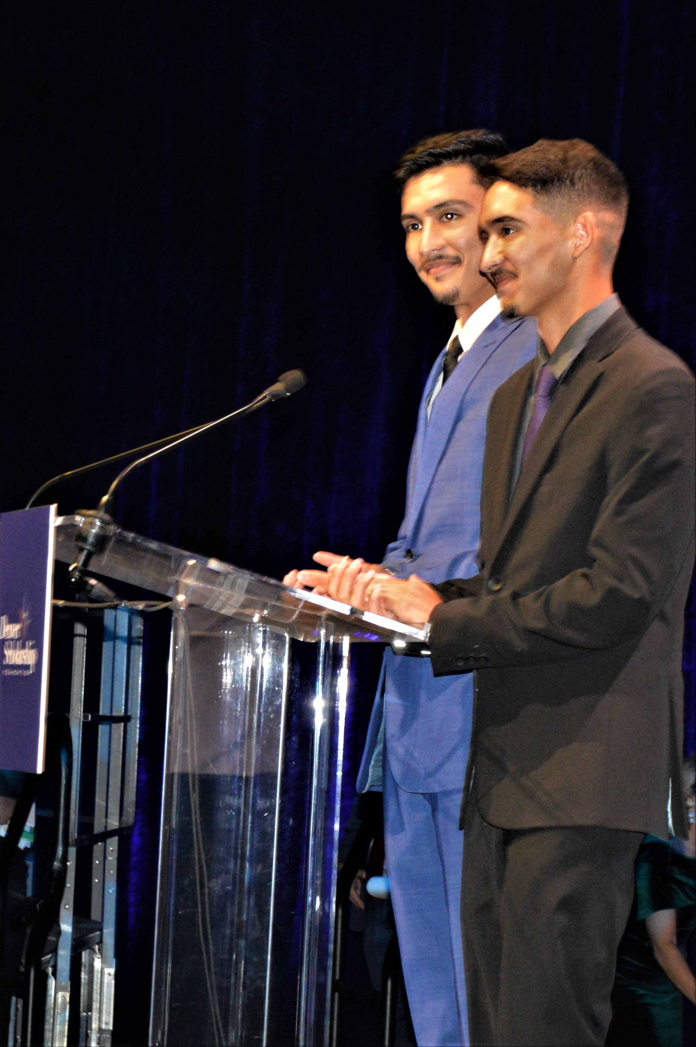 DSF scholars Lazarus West (left) and Lawrence West speak to the crowd.