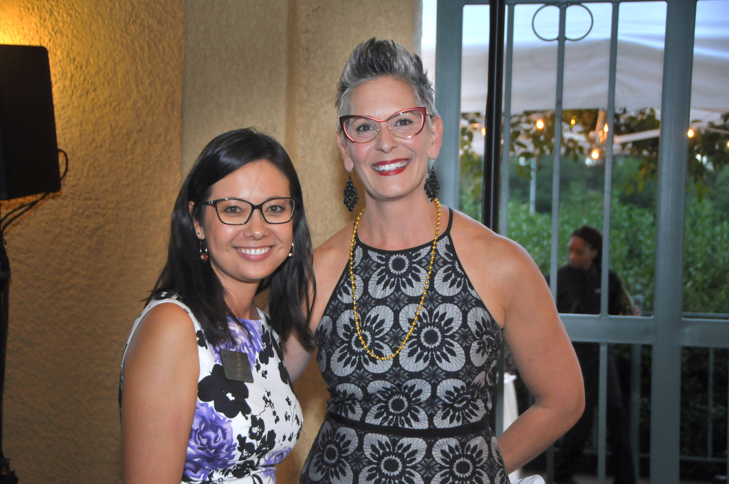 Executive Director Kim Yuan-Farrell with auctioneer Debbie Scheer