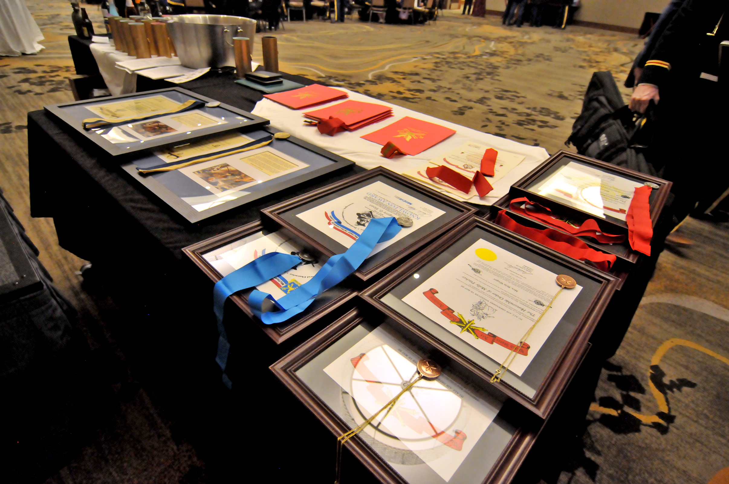 A table featuring the evening awards and recognition plaques