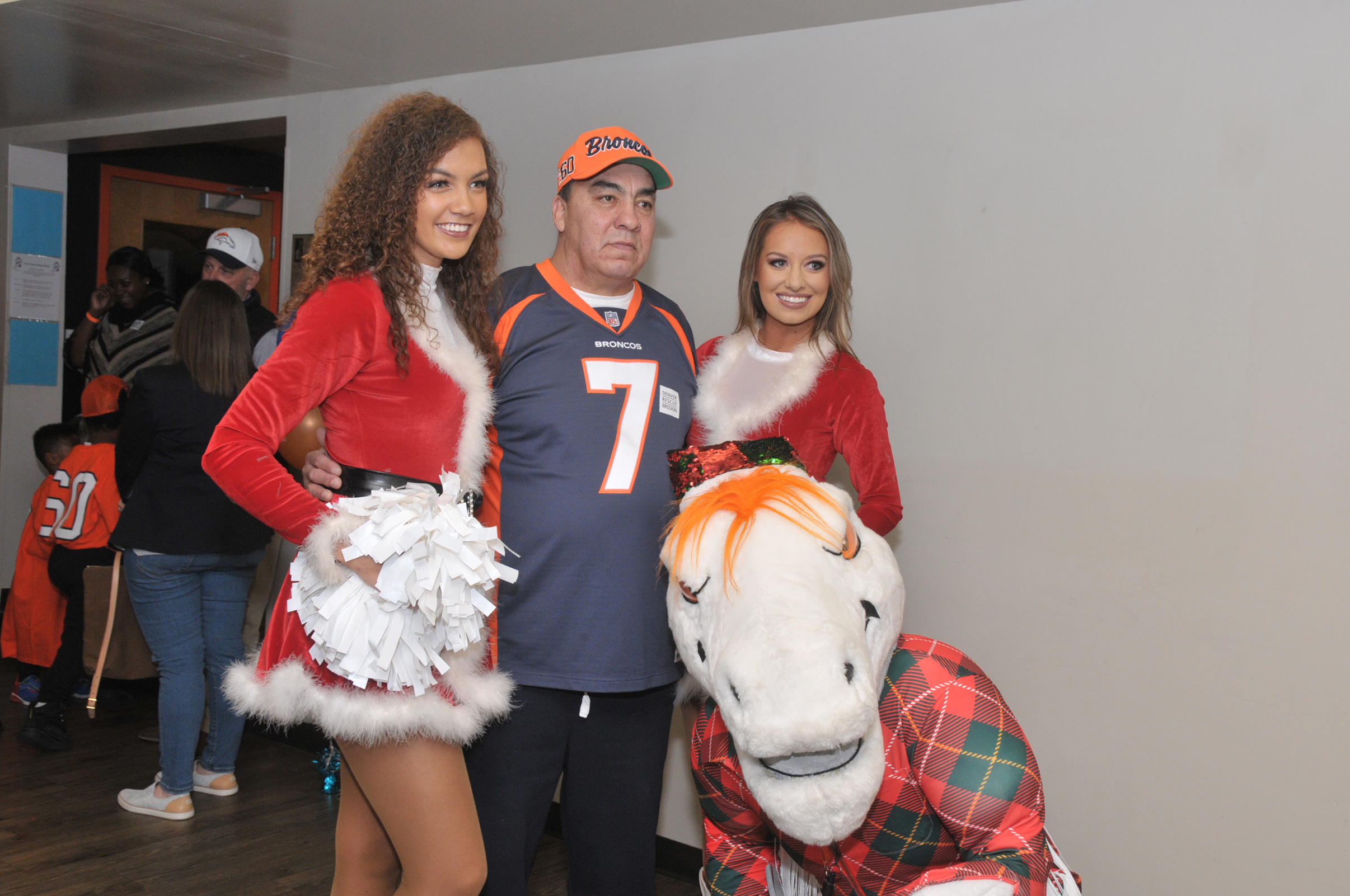 Broncos fans lined up to meet cheerleaders and Miles