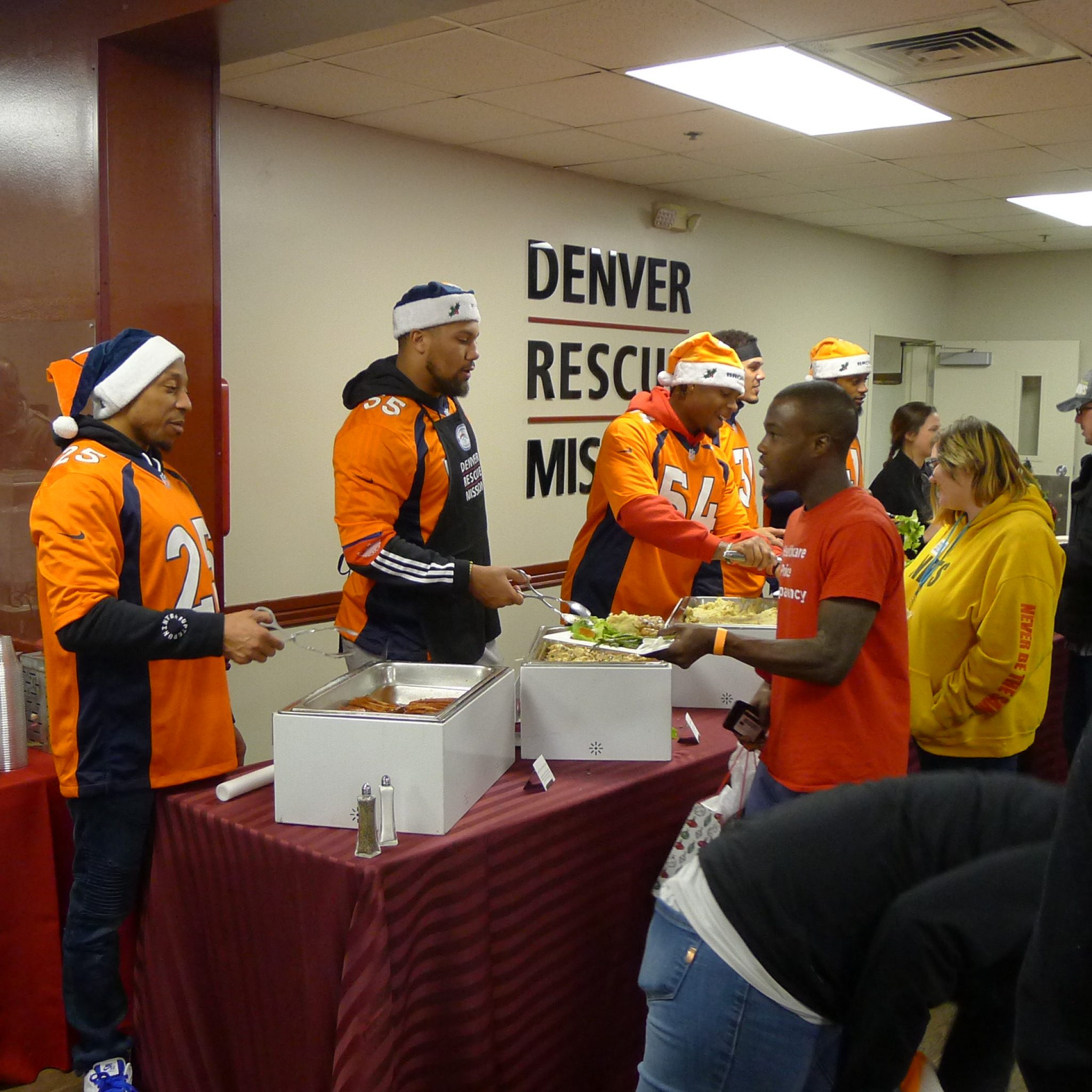 Every year Broncos players serve guests a special holiday meal
