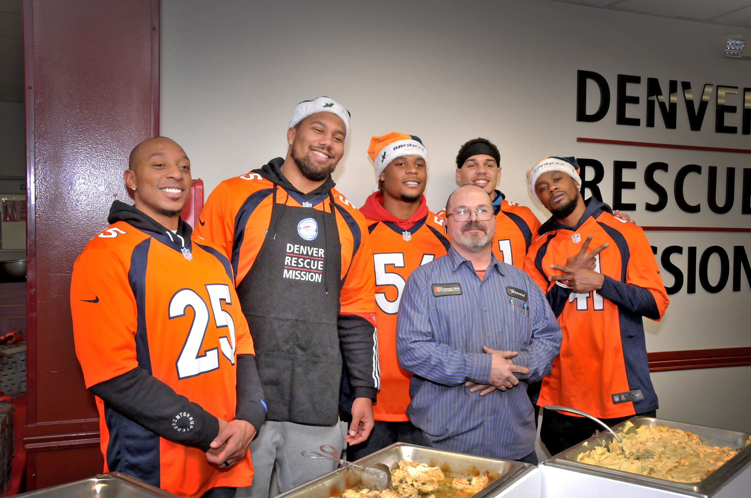 Broncos players served a buffet all night and posed with fans
