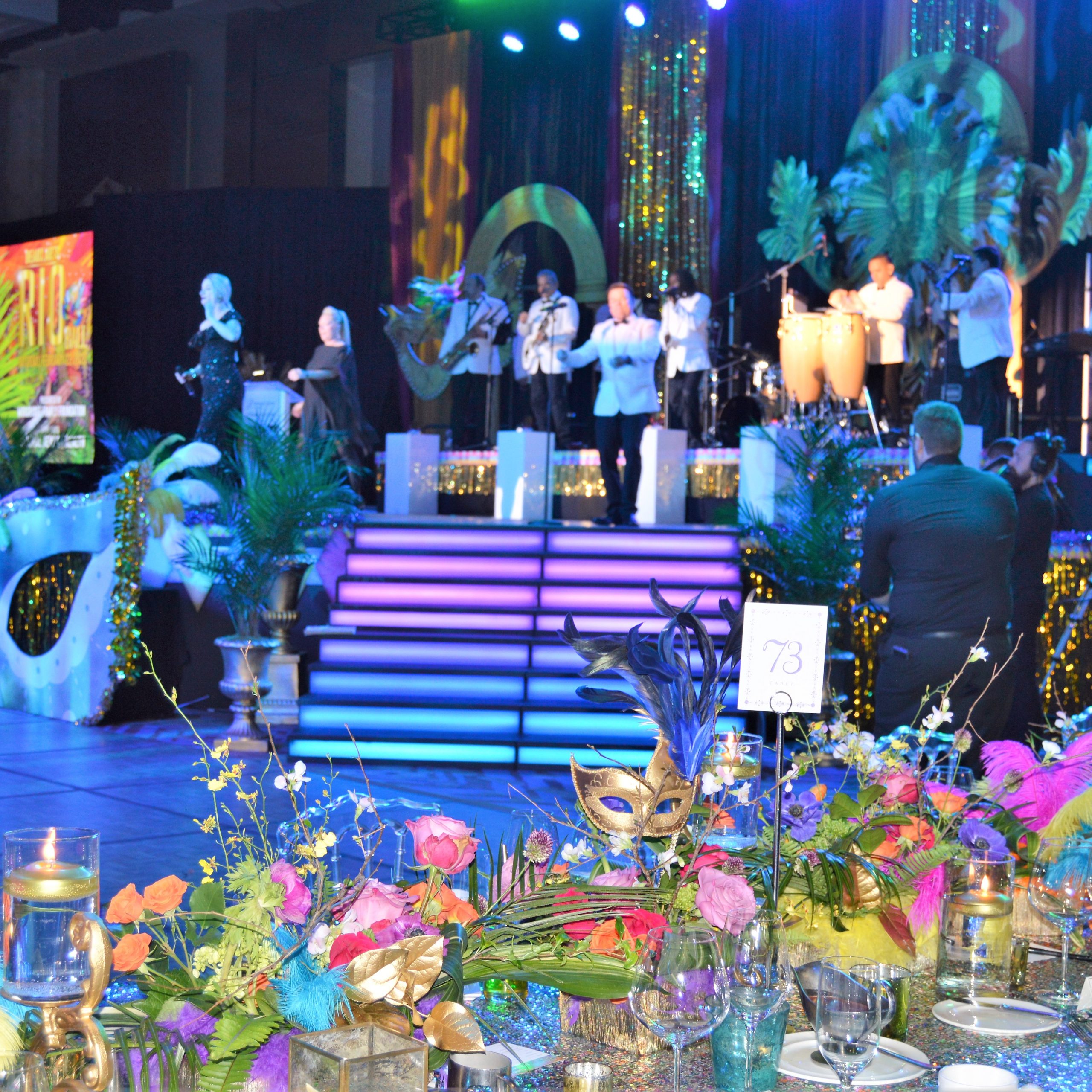 One of the pretty VIP tables with florals by Design Works and a parrot ...