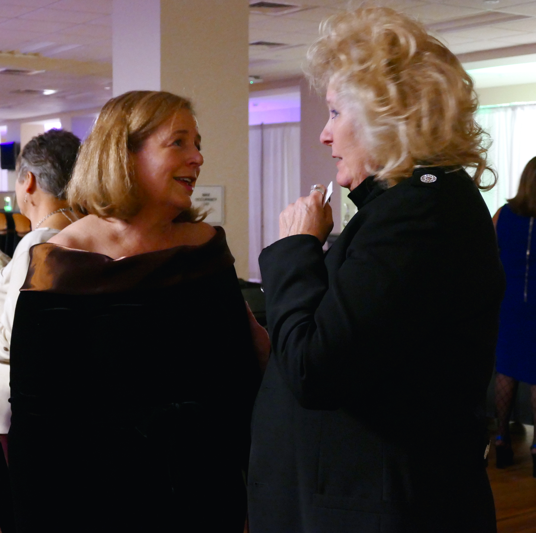 Debi Robbe, left, chats with June King