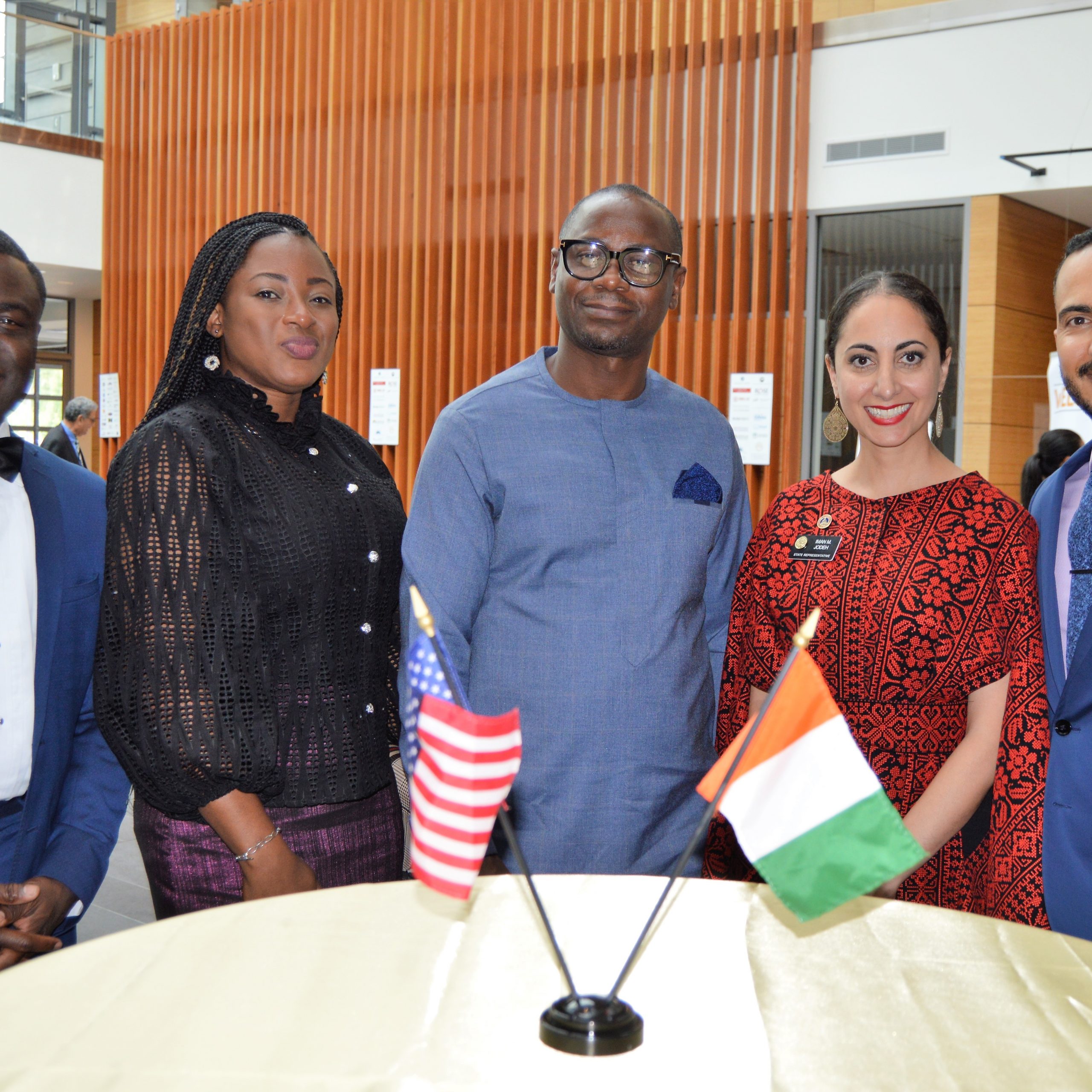 Standing with U.S. and Ivory Coast flags (l to r): Evans Kwesi Mensah ...