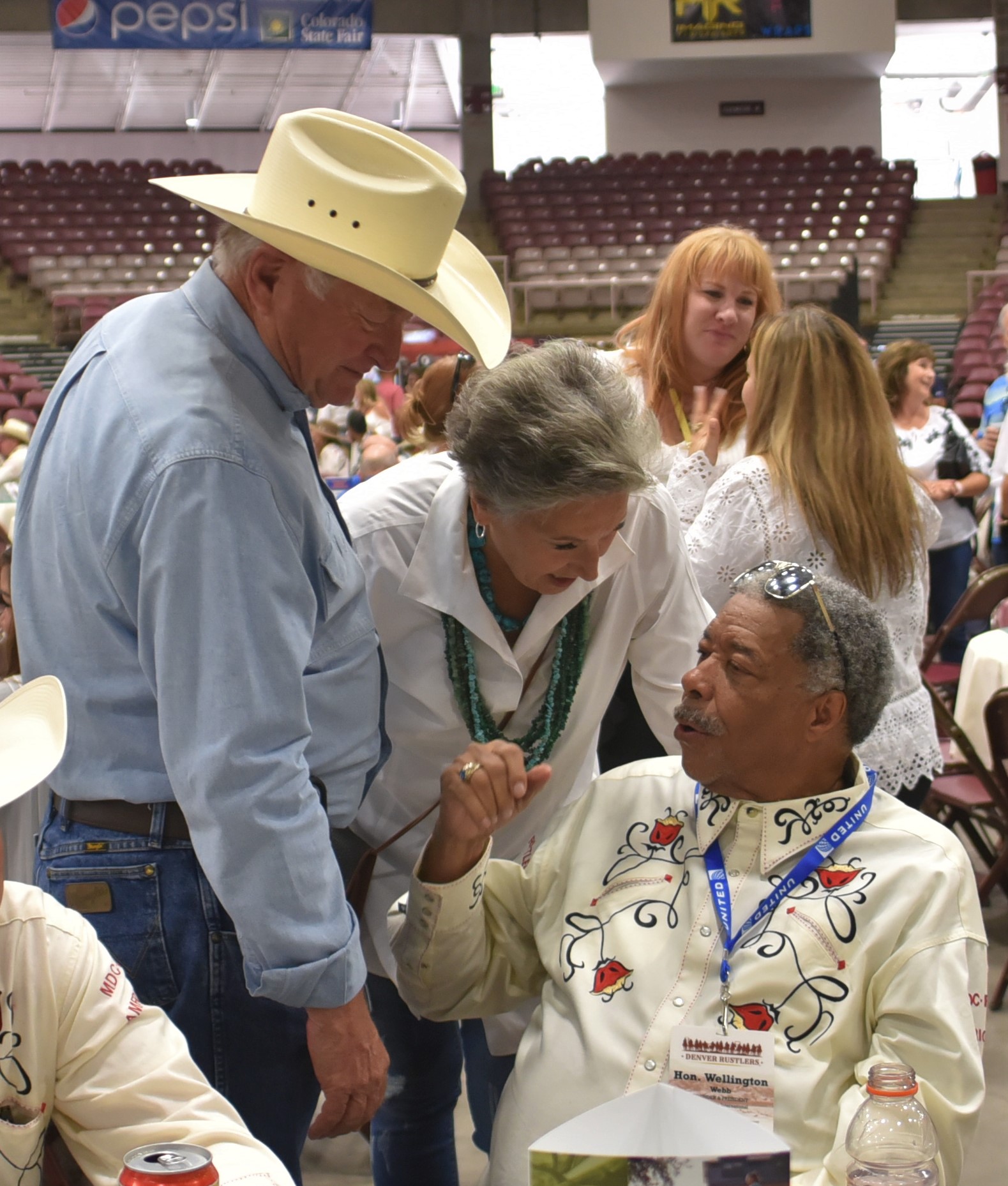 Pueblo Mayor Nick Gradisar and Martha Simmons chat with Wellington Webb