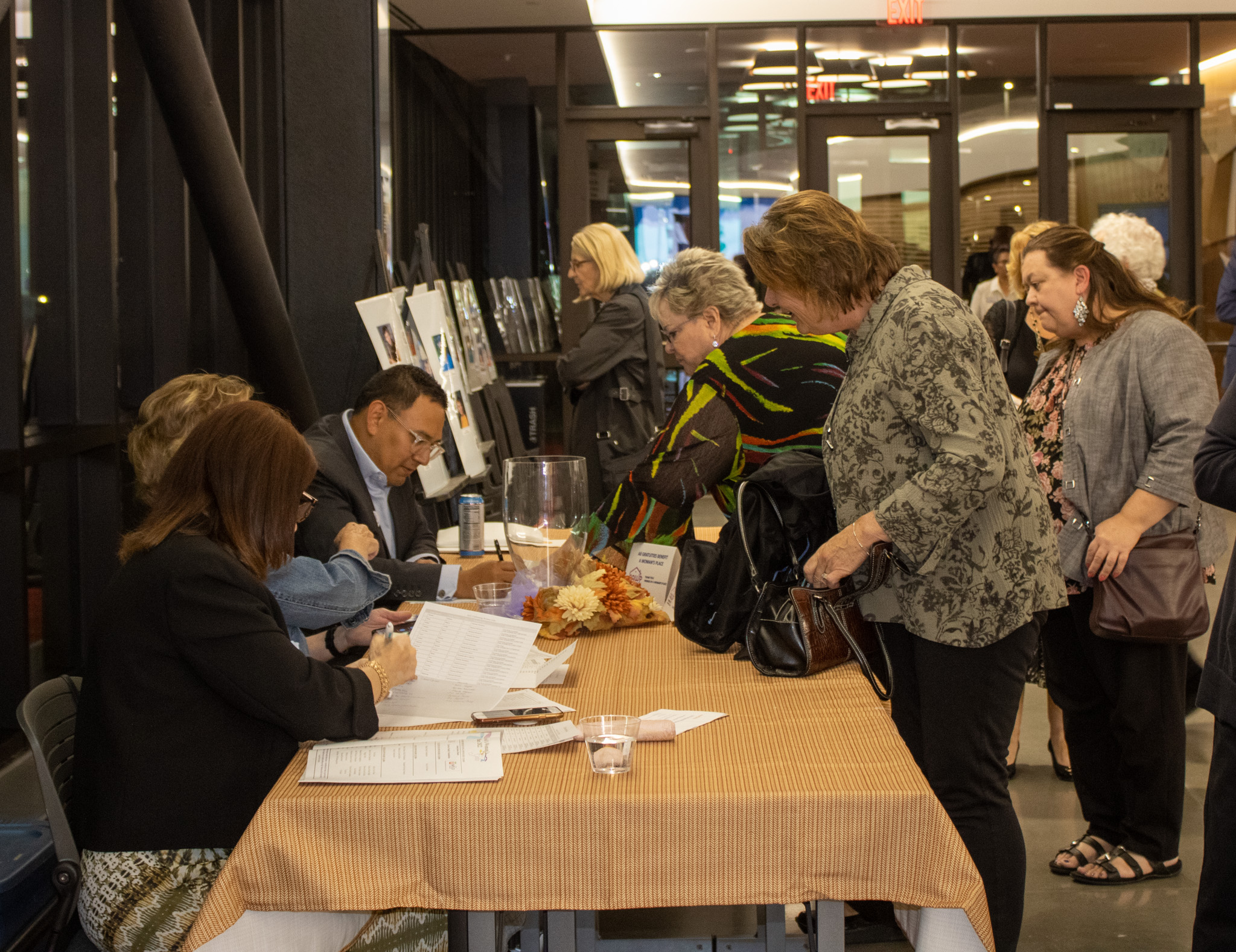 Attendees checking in at registration.