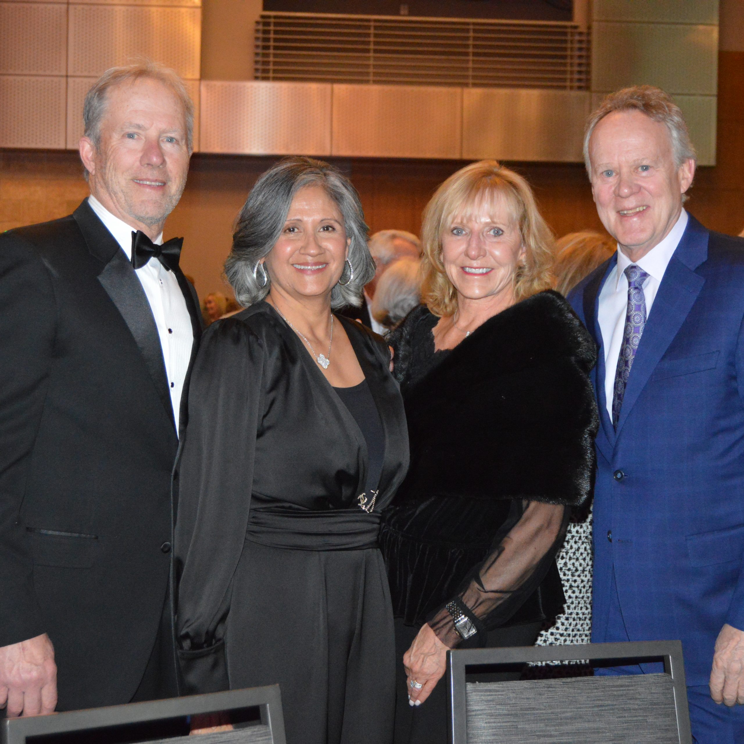 Gene and 2025 laureate Anita Padilla-Fitzgerald (left) and friends